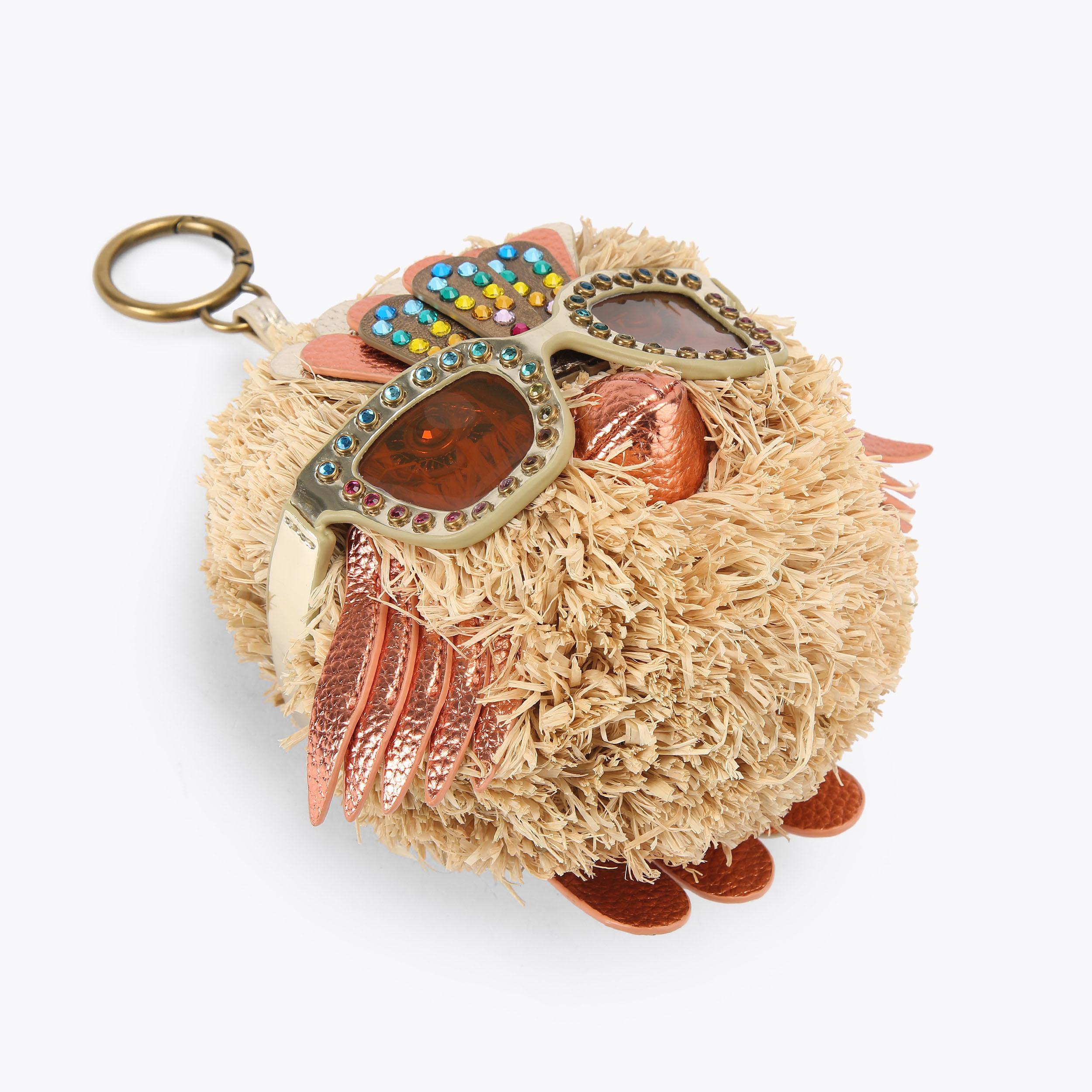 POM POM EAGLE SUNGL CHARM Beige Raffia Pom Pom Charm by Kurt Geiger London